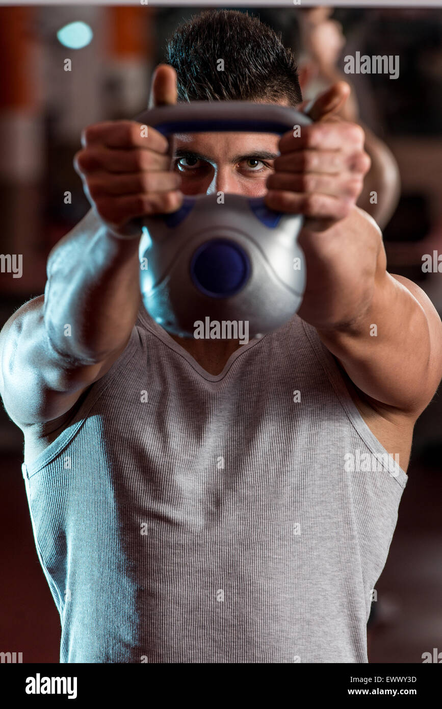 Athletic Men Workout With Kettle Bell Stock Photo - Alamy