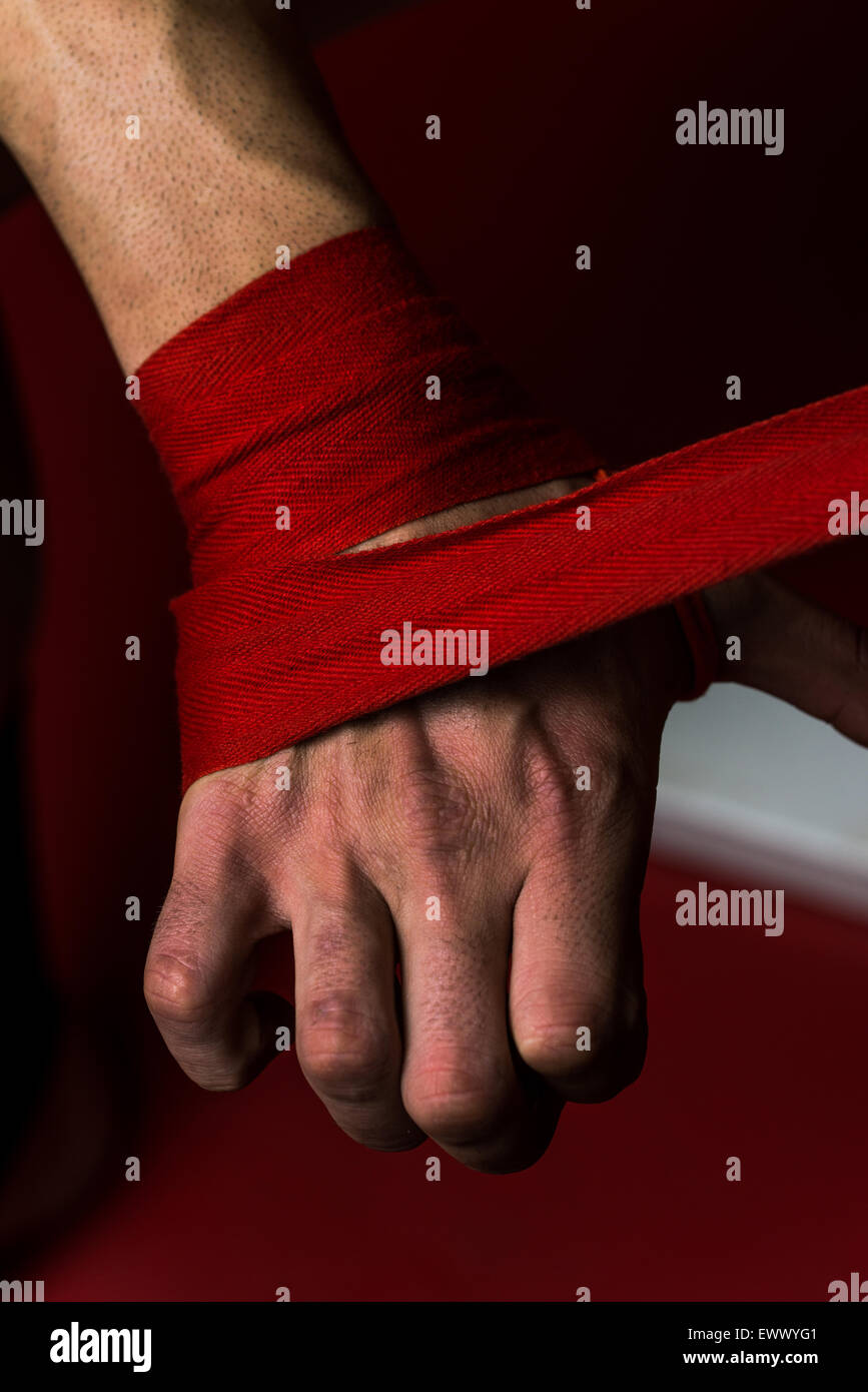 Boxer Putting On Straps Preparing For Combat Stock Photo - Alamy