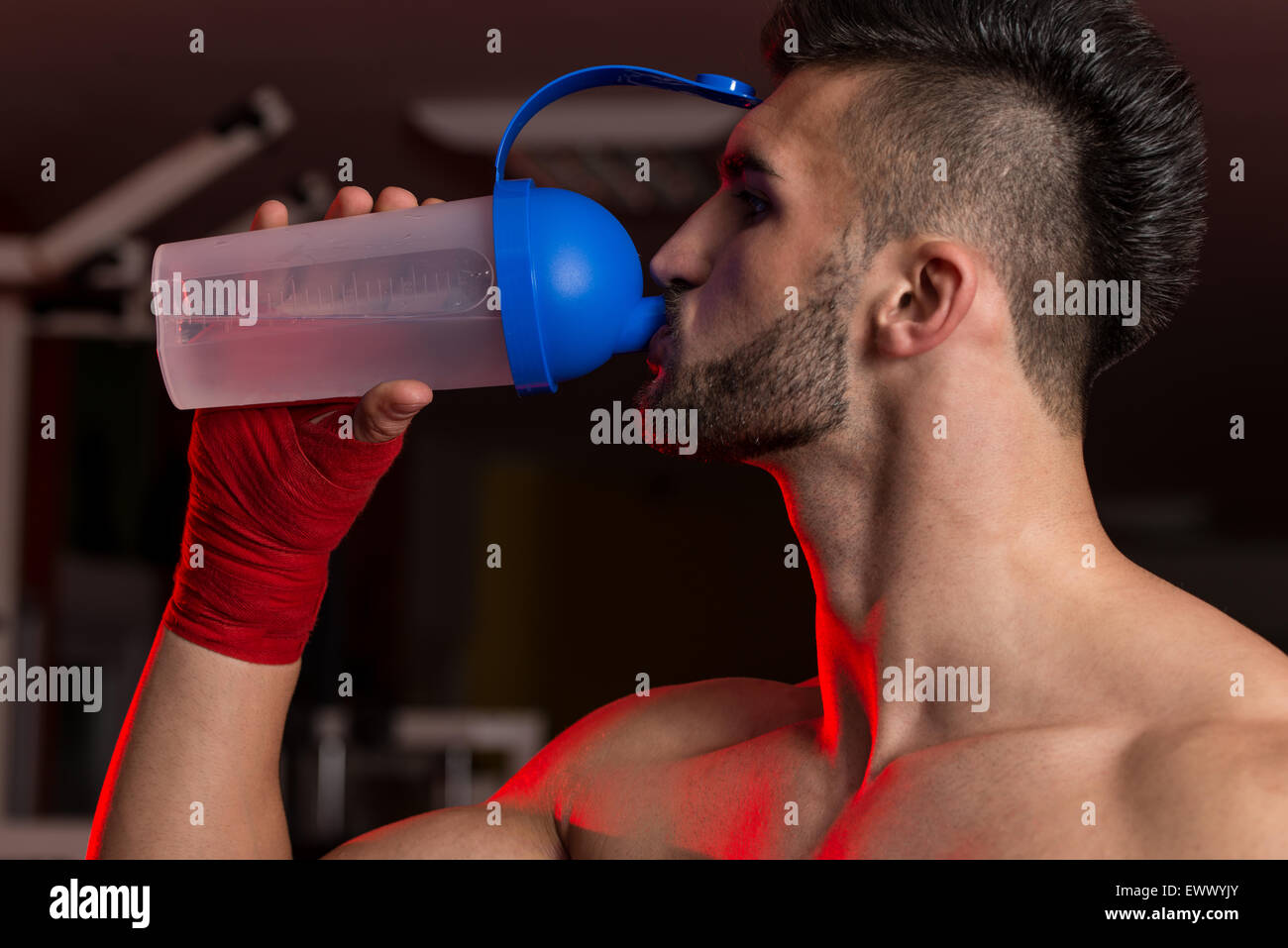 Muscular men drinking water from hi-res stock photography and images ...
