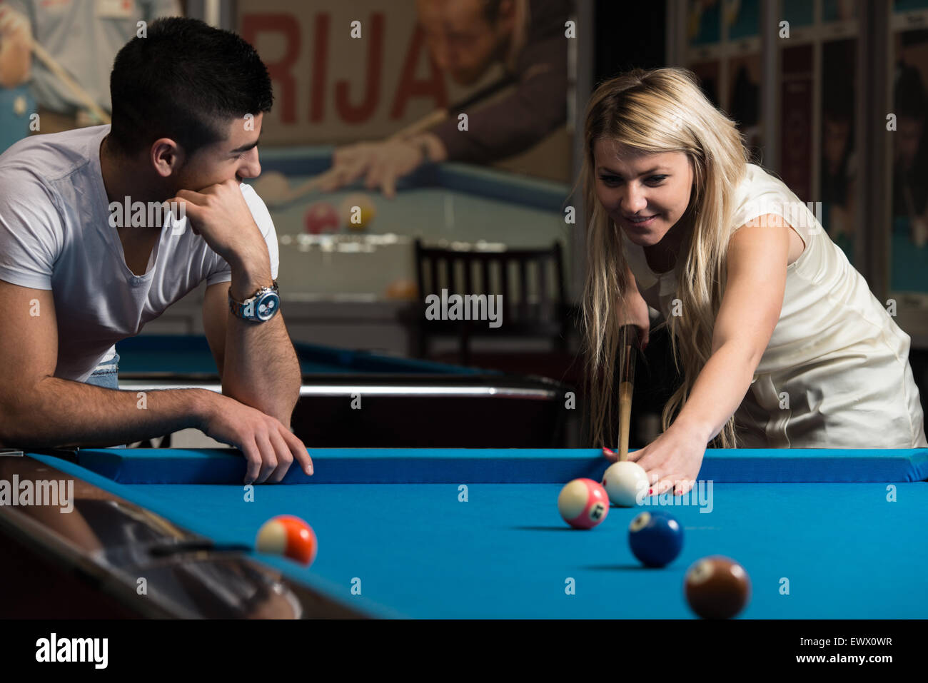 Boy And Girl Flirting On A Pool Game Stock Photo - Alamy