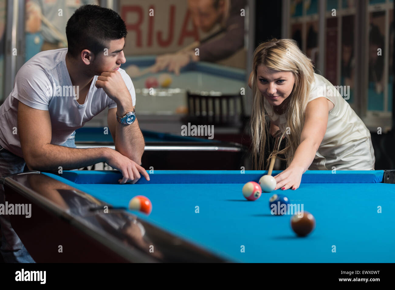 Young Couple Playing Pool Together Stock Photo - Alamy