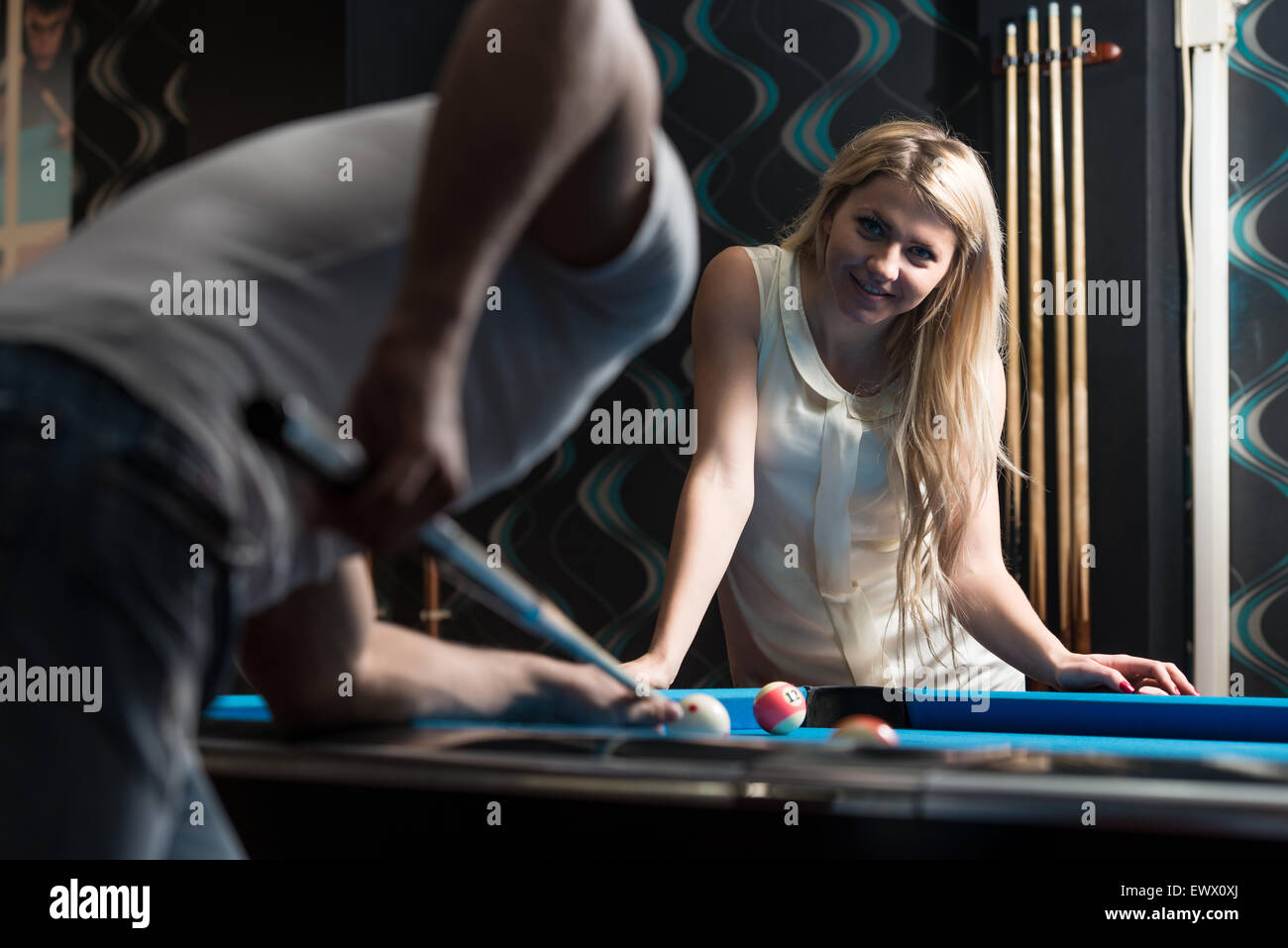 Young Couple Playing Pool Together Stock Photo - Alamy