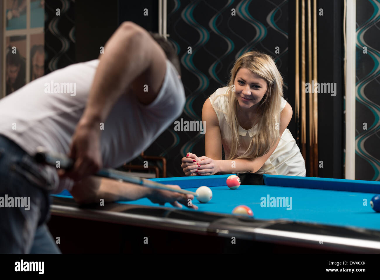 Boy And Girl Flirting On A Pool Game Stock Photo - Alamy