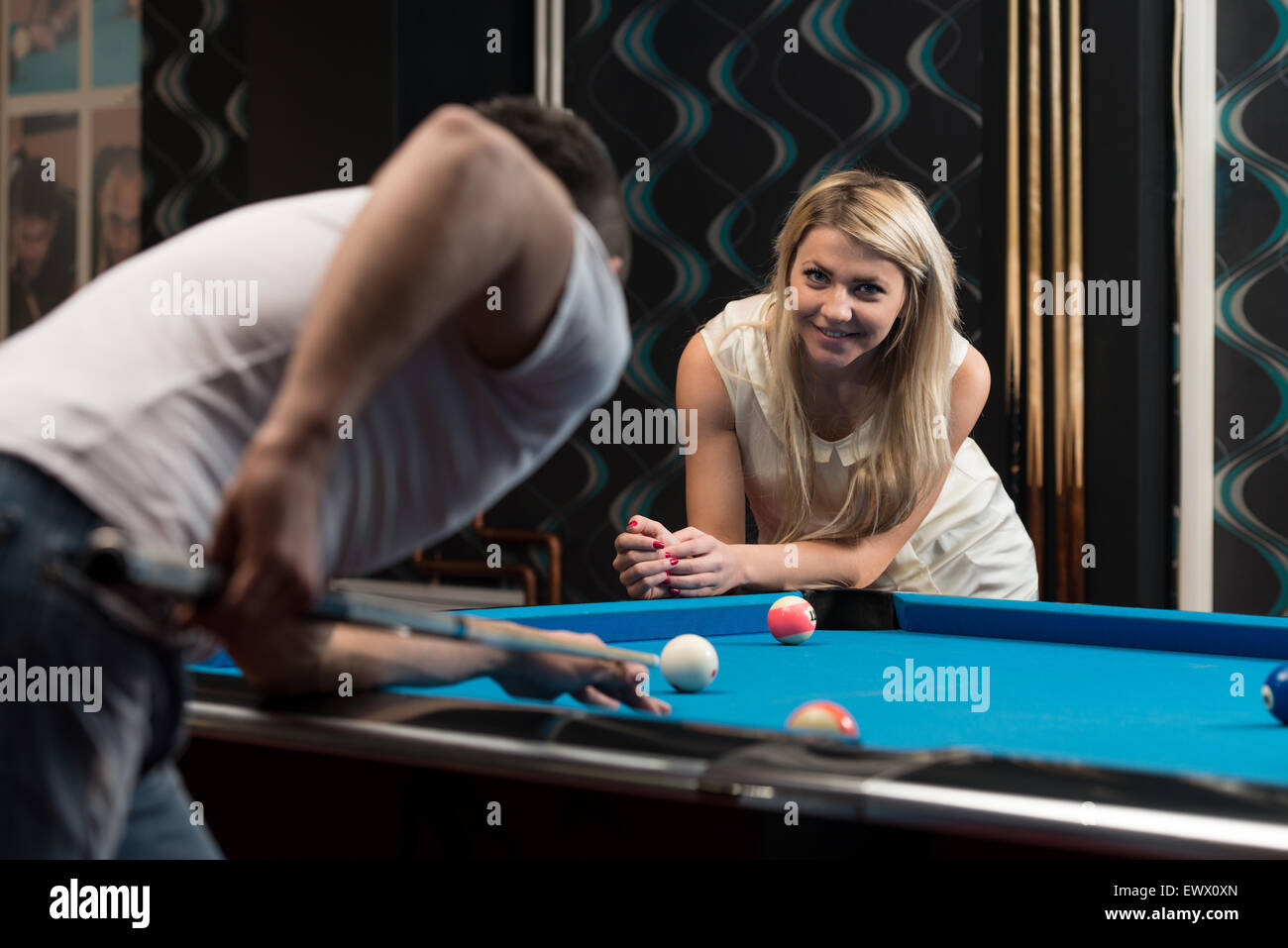 Beautiful Couple Playing Pool Stock Photo - Alamy