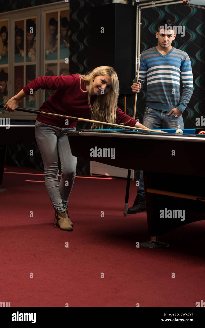 Man Teaching Woman How To Play Pool Stock Photo - Alamy