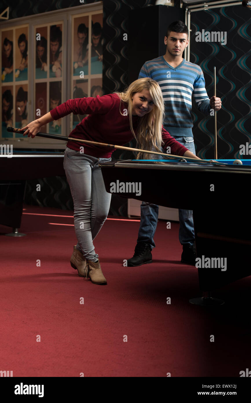 Beautiful Couple Playing Pool Stock Photo - Alamy