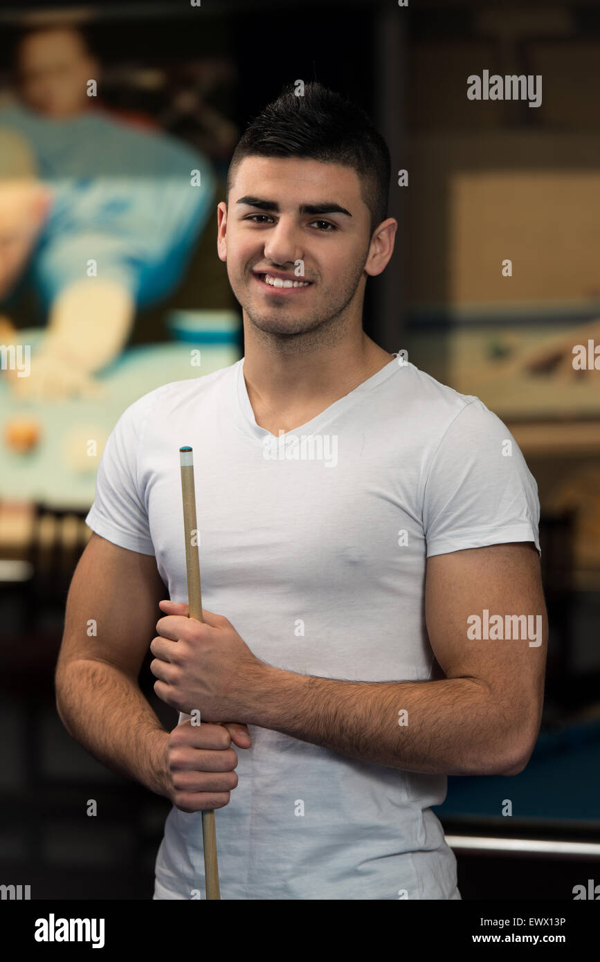 Close-Up Of A Young Female Model Playing Billiards Stock Photo - Alamy