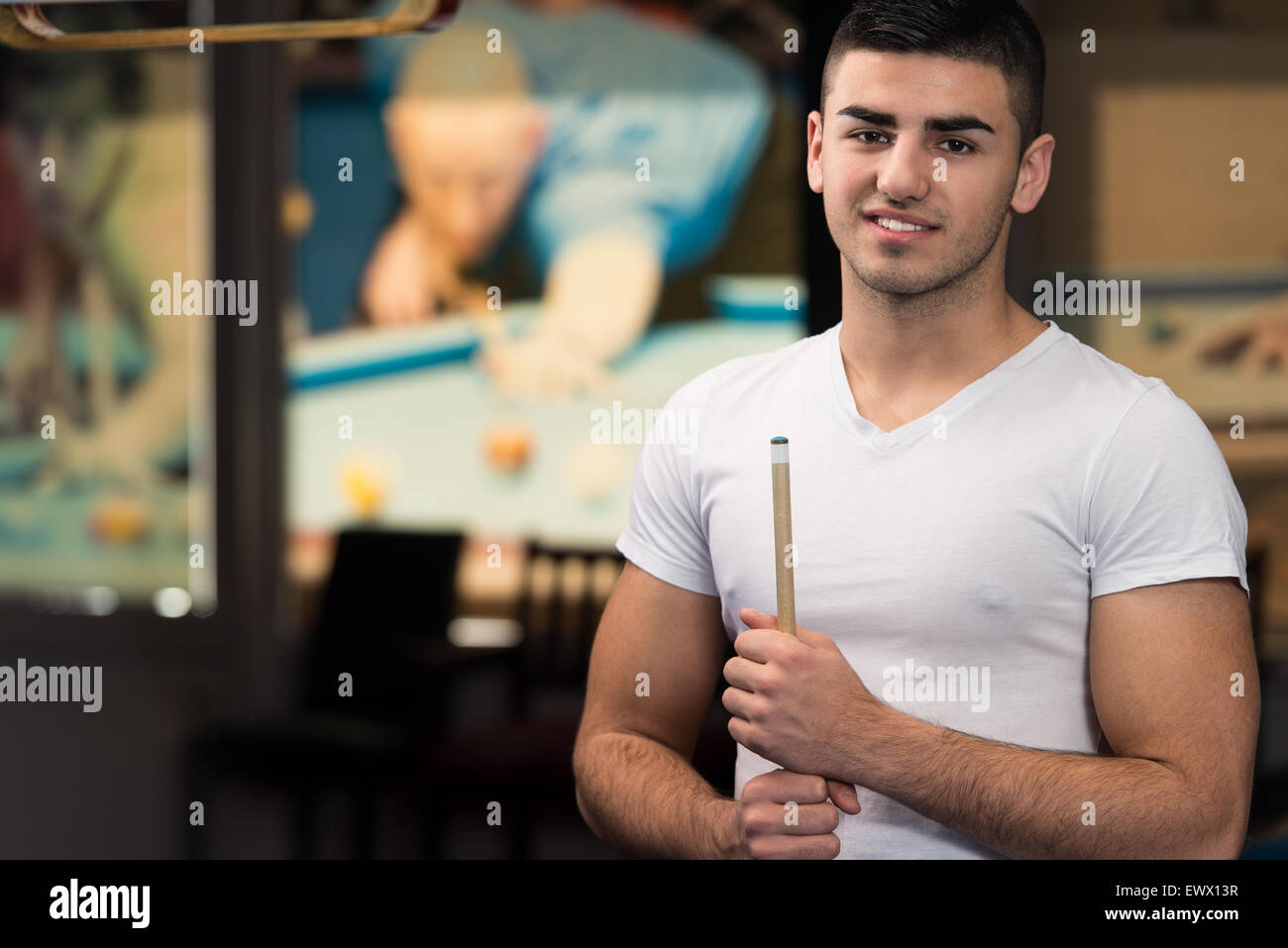 Portrait Of A Young Male Model Playing Billiards Stock Photo - Alamy