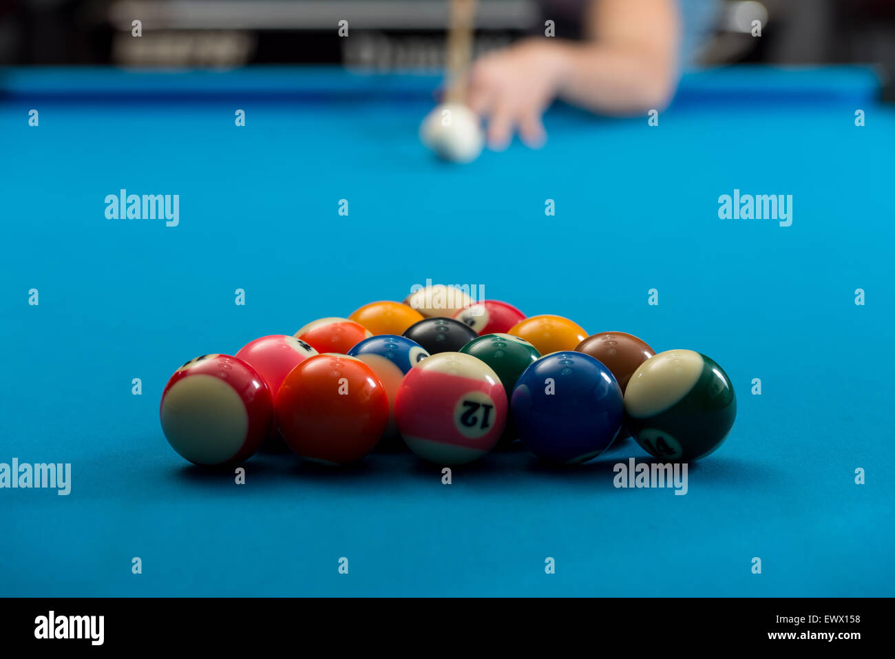 Man Playing Pool About to Hit Ball Stock Photo - Alamy