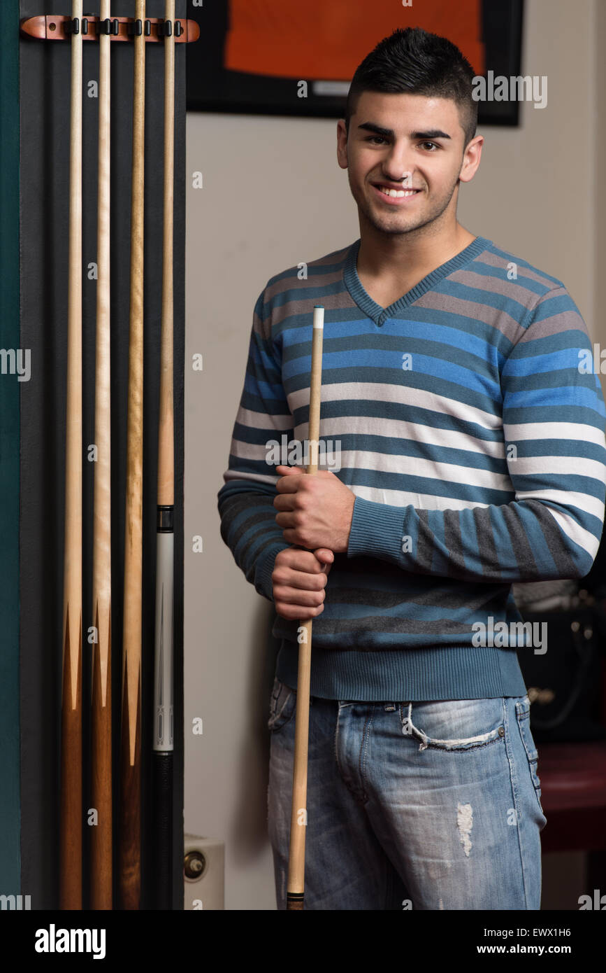 Close-Up Of A Young Female Model Playing Billiards Stock Photo - Alamy