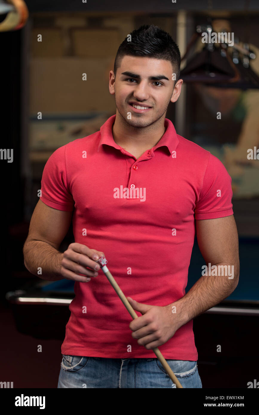 Smiling Happy Man Playing Billiard Stock Photo - Alamy