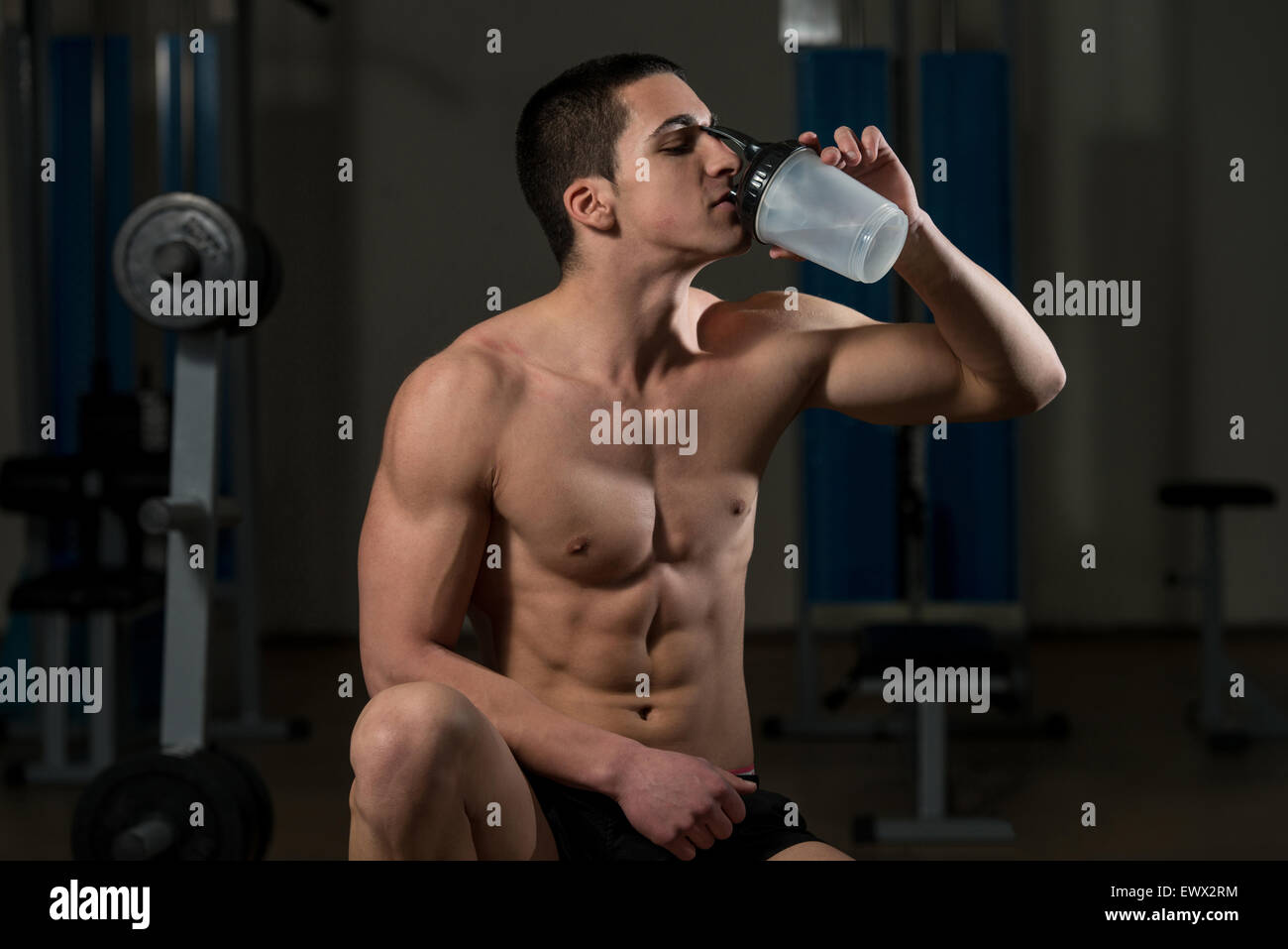 Young Muscular Man Drinking A Water Bottle Stock Photo - Alamy