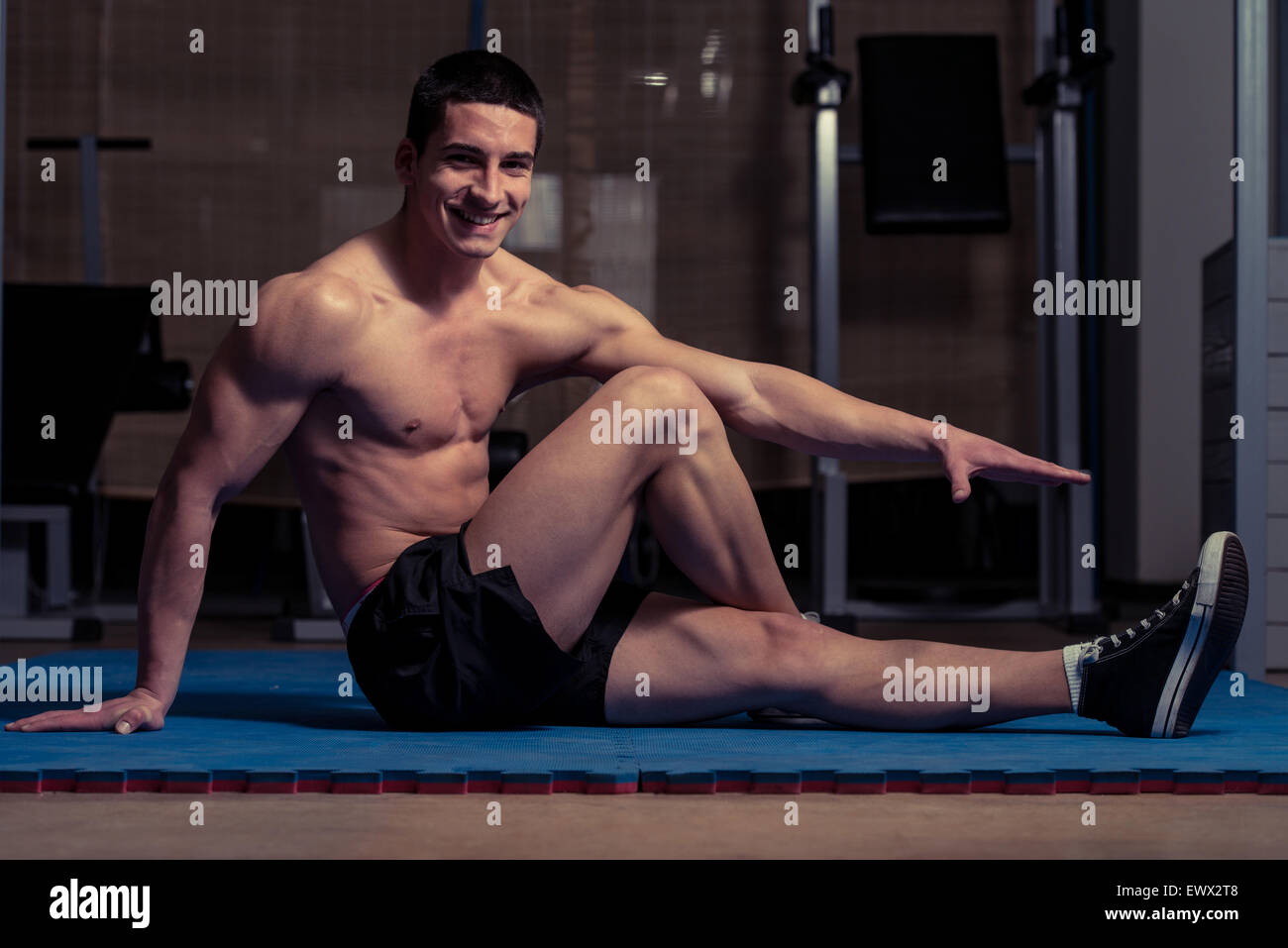 Athletic Man Stretches Stock Photo - Alamy