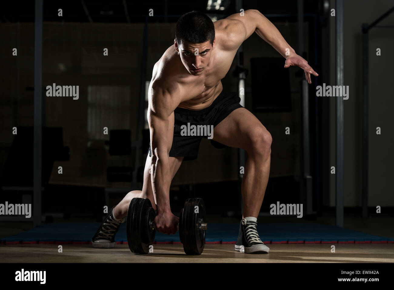 Young Body Builder Lifting Heavy Dumbbell Stock Photo - Alamy