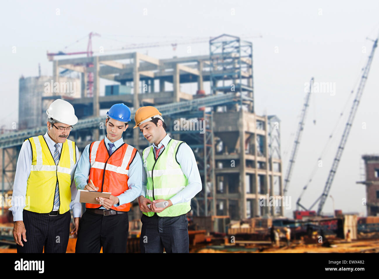 3 indian Architect Construction Site Clipboard Discussion Stock Photo ...