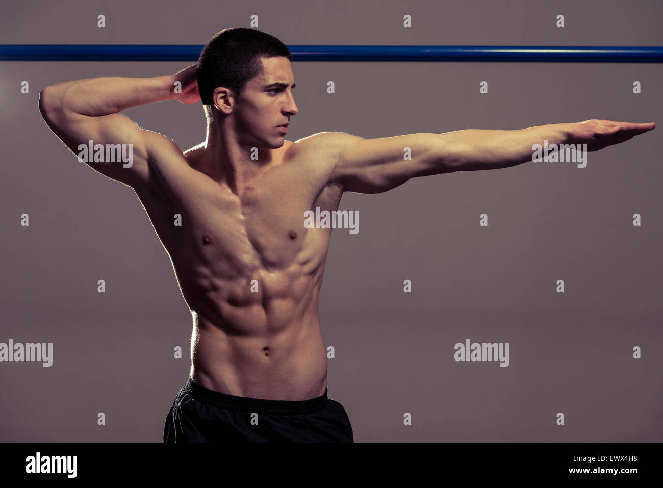 Young Muscular Men Flexing Muscles Stock Photo - Alamy