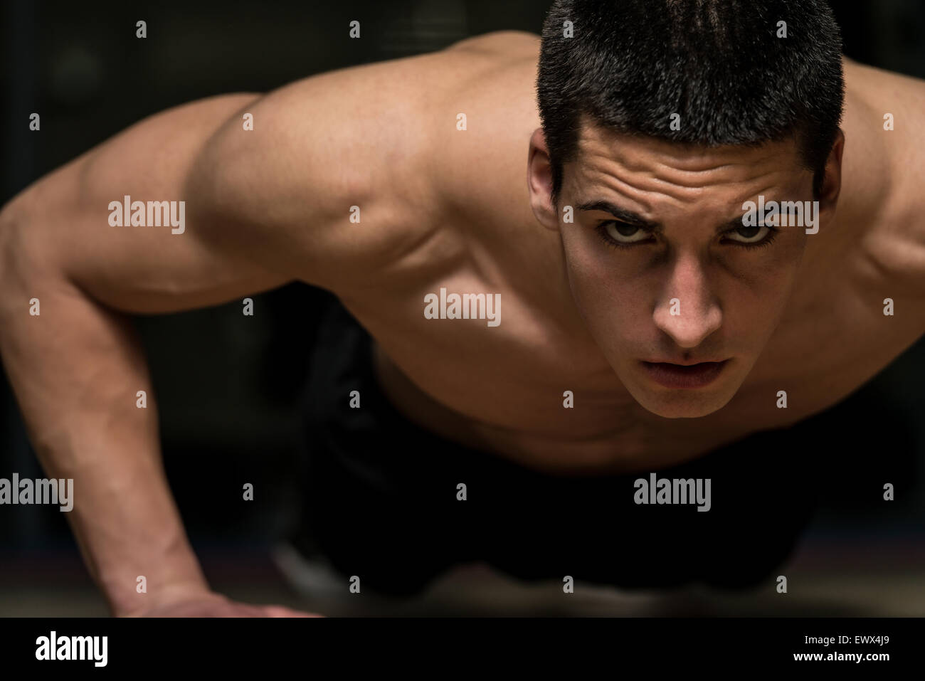 Teenage boy flexing arm muscle hi-res stock photography and images - Alamy