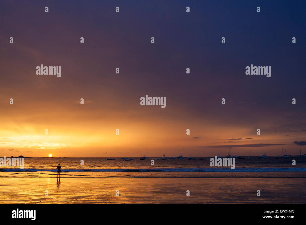 A spectacular and colorful sunset on the beach in Tamarindo Costa rica ...