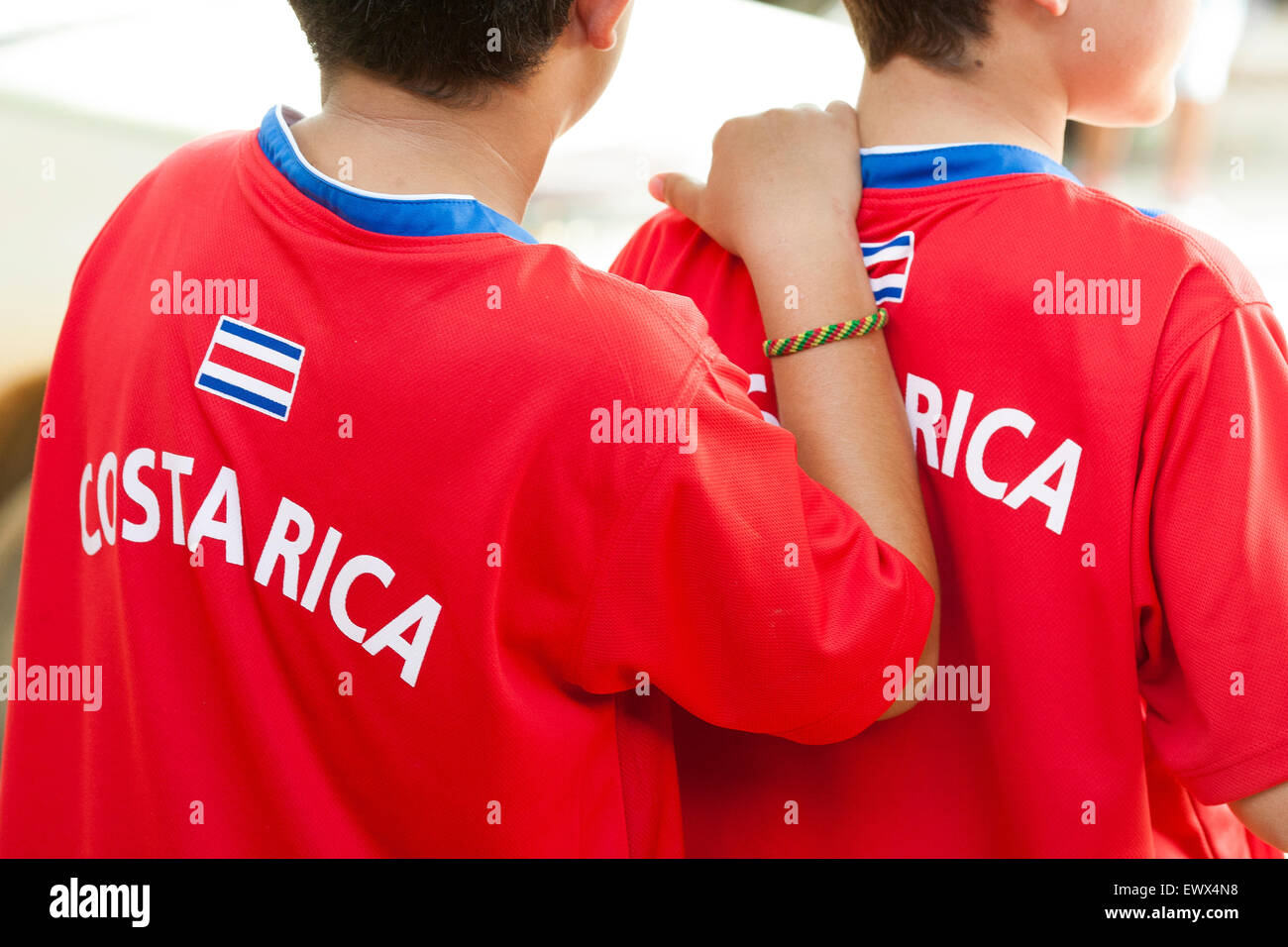 Two boys in national football shirts as Tico's celebrate their country ...
