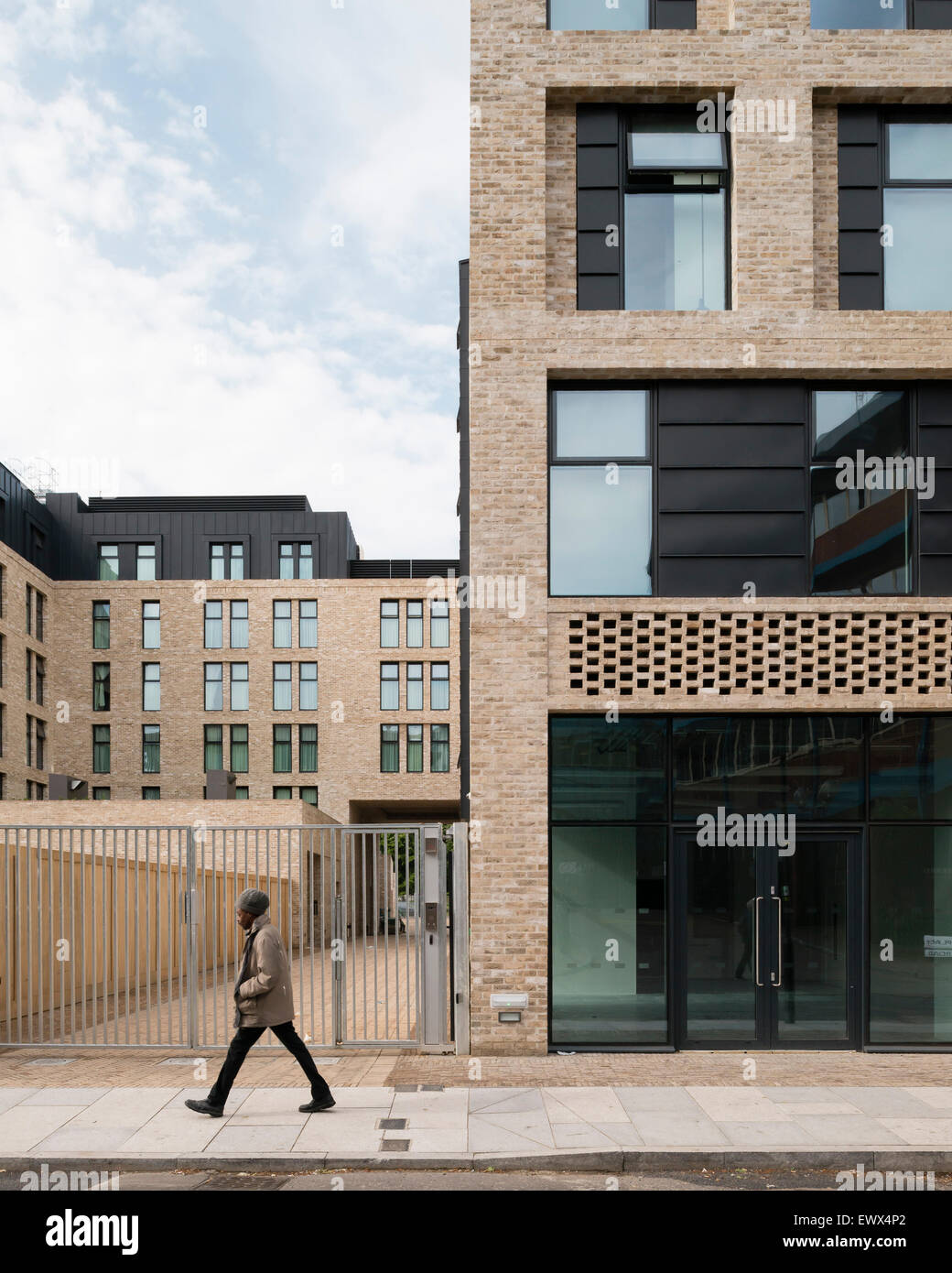 Detail view of exterior facade with entrance and gate. Spring Mews ...