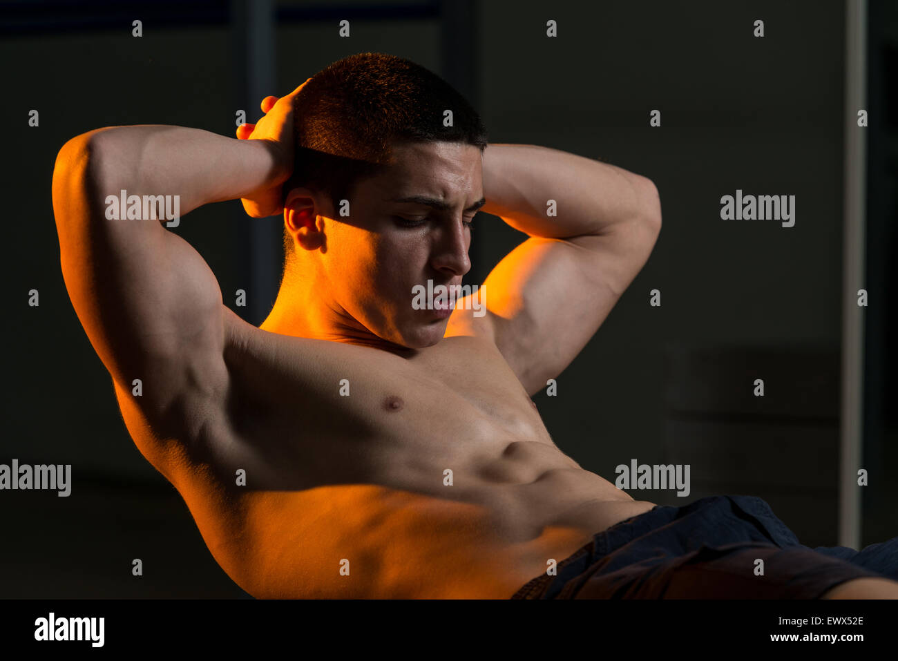 Young Man Working Out With An Exercise Ball Stock Photo - Alamy