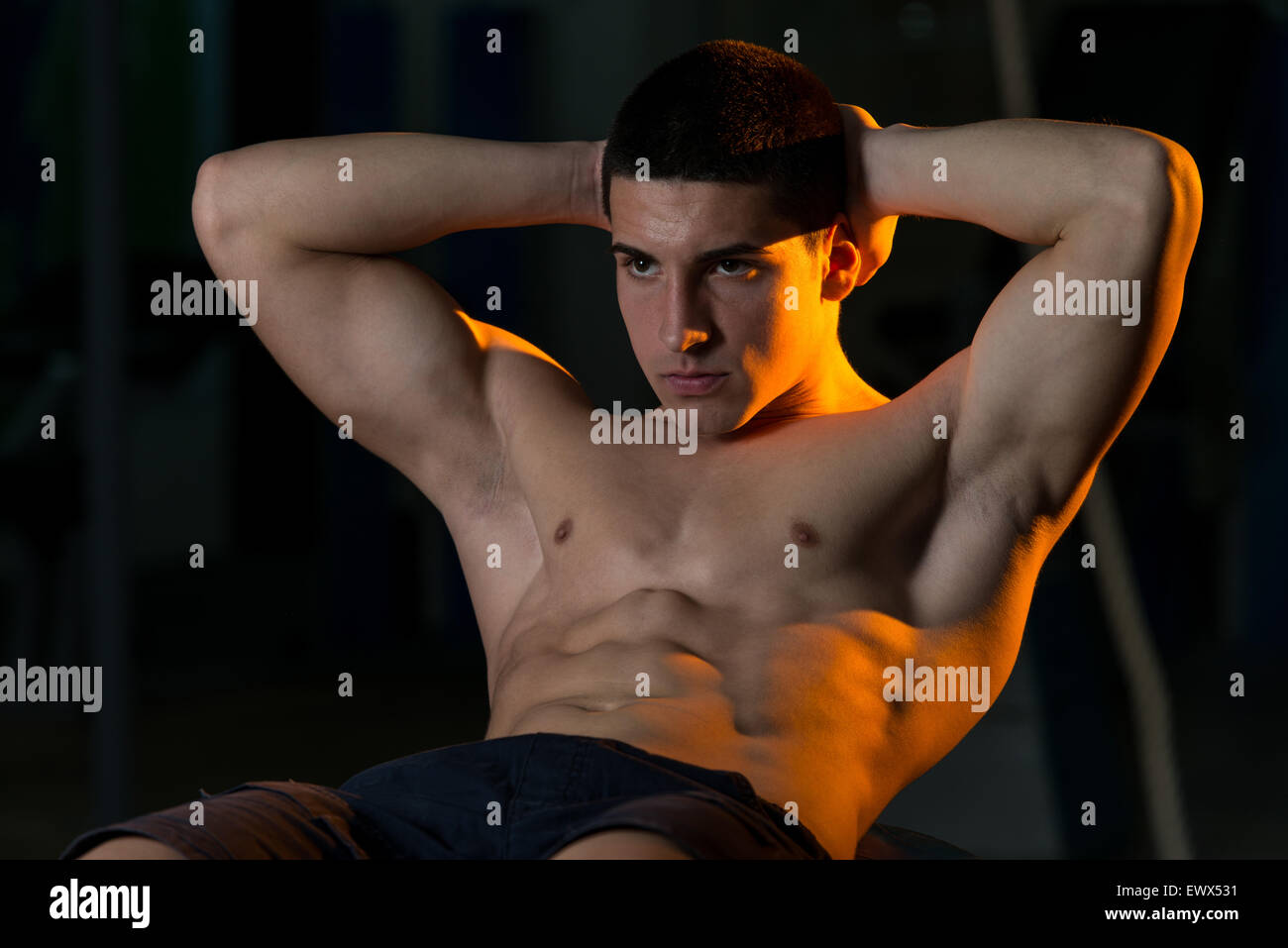 Young man doing sit ups hi-res stock photography and images - Alamy