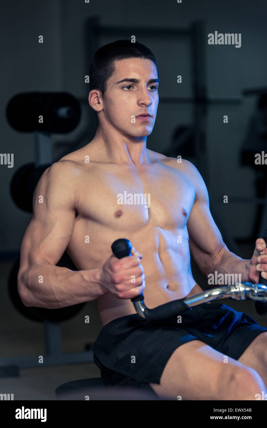 Back Exercises On A Seated Row Machine Stock Photo - Alamy