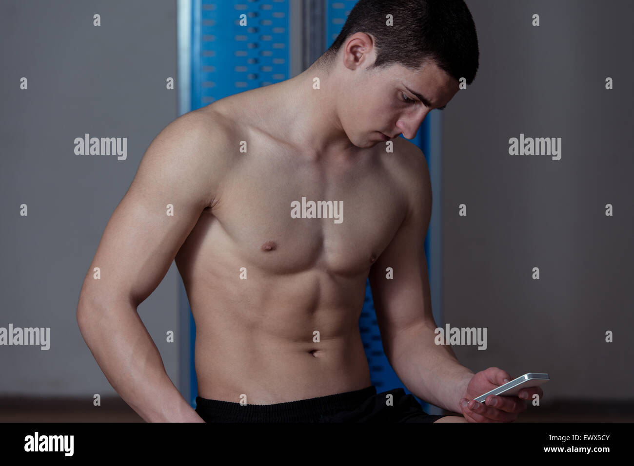 Young Man Texting While Fitness Sesion Stock Photo - Alamy