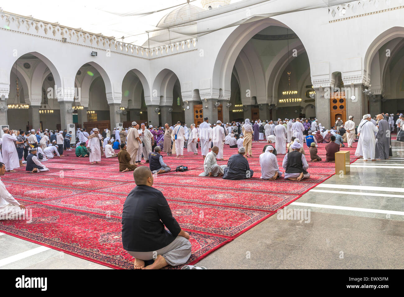 MEDINA, SAUDI ARABIA - MARCH 07, 2015 : Muslims pray inside Masjid Quba ...
