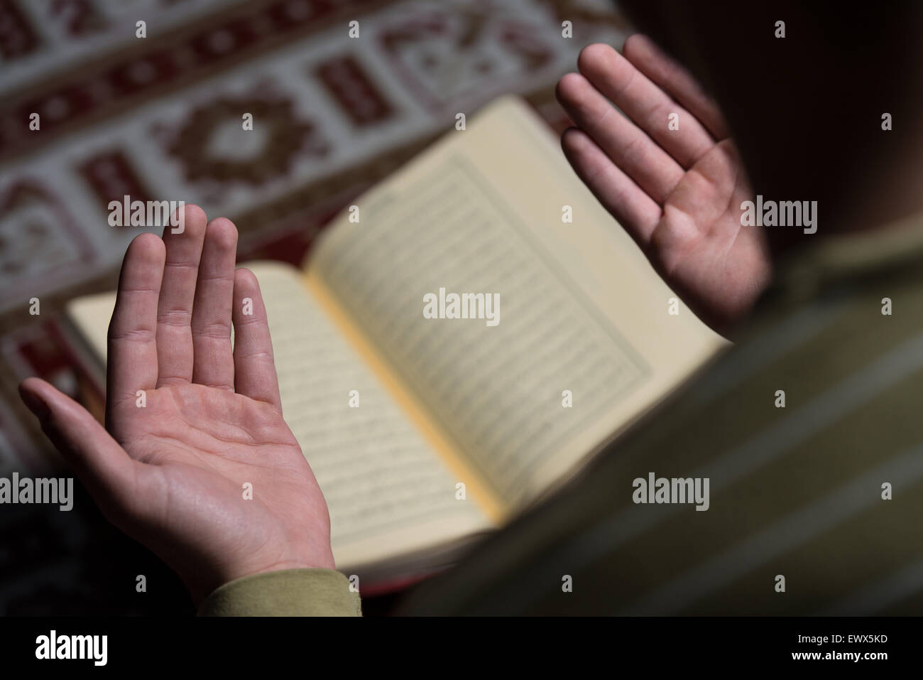 Muslim Man Is Reading The Koran Stock Photo - Alamy