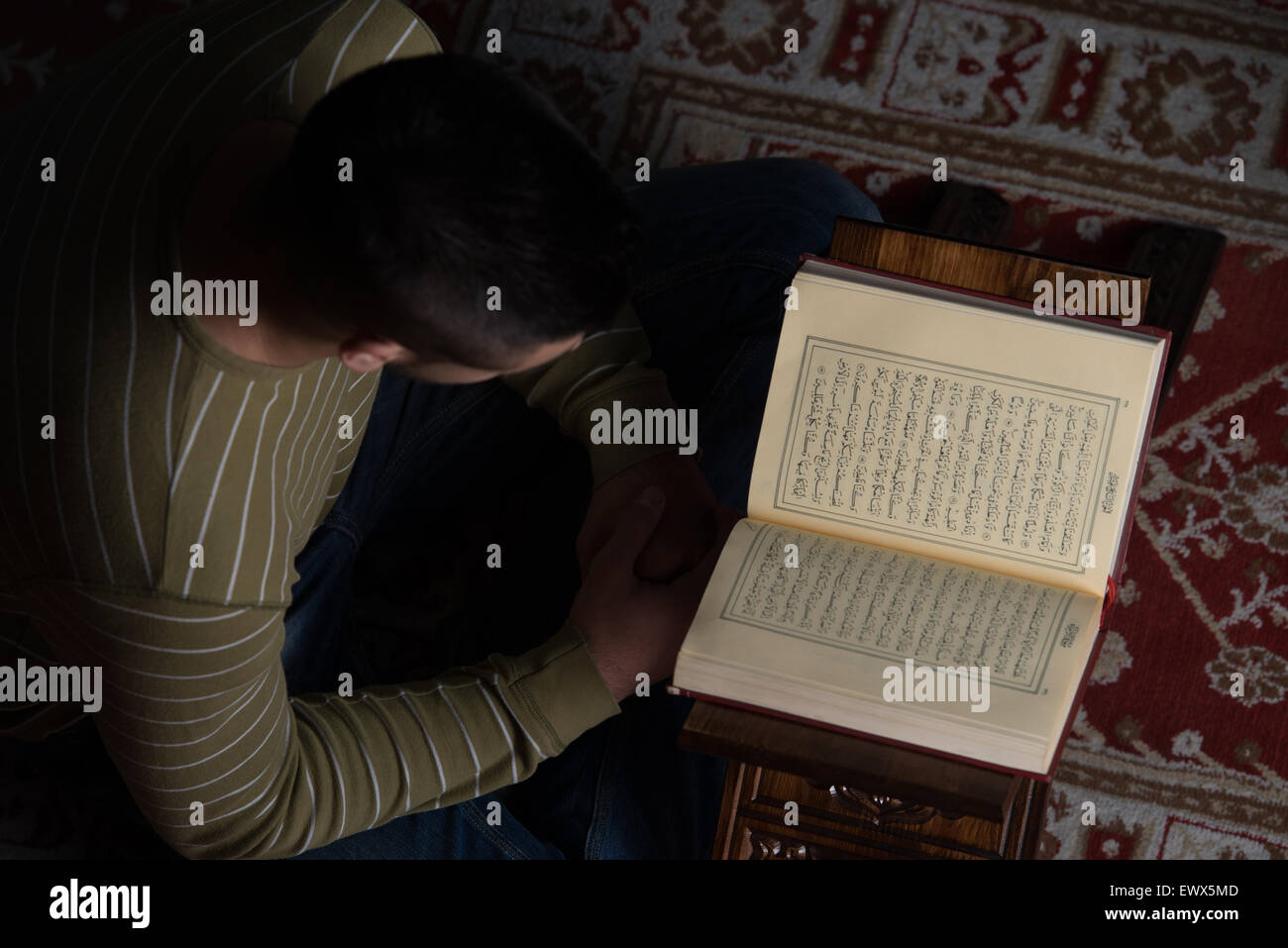 Muslim Man Is Reading The Koran Stock Photo - Alamy