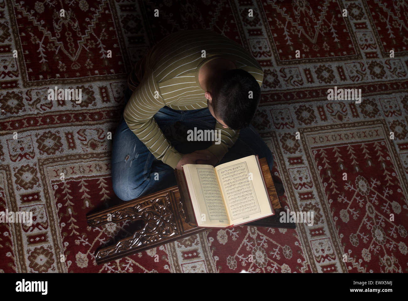 Muslim Man Is Reading The Koran Stock Photo - Alamy