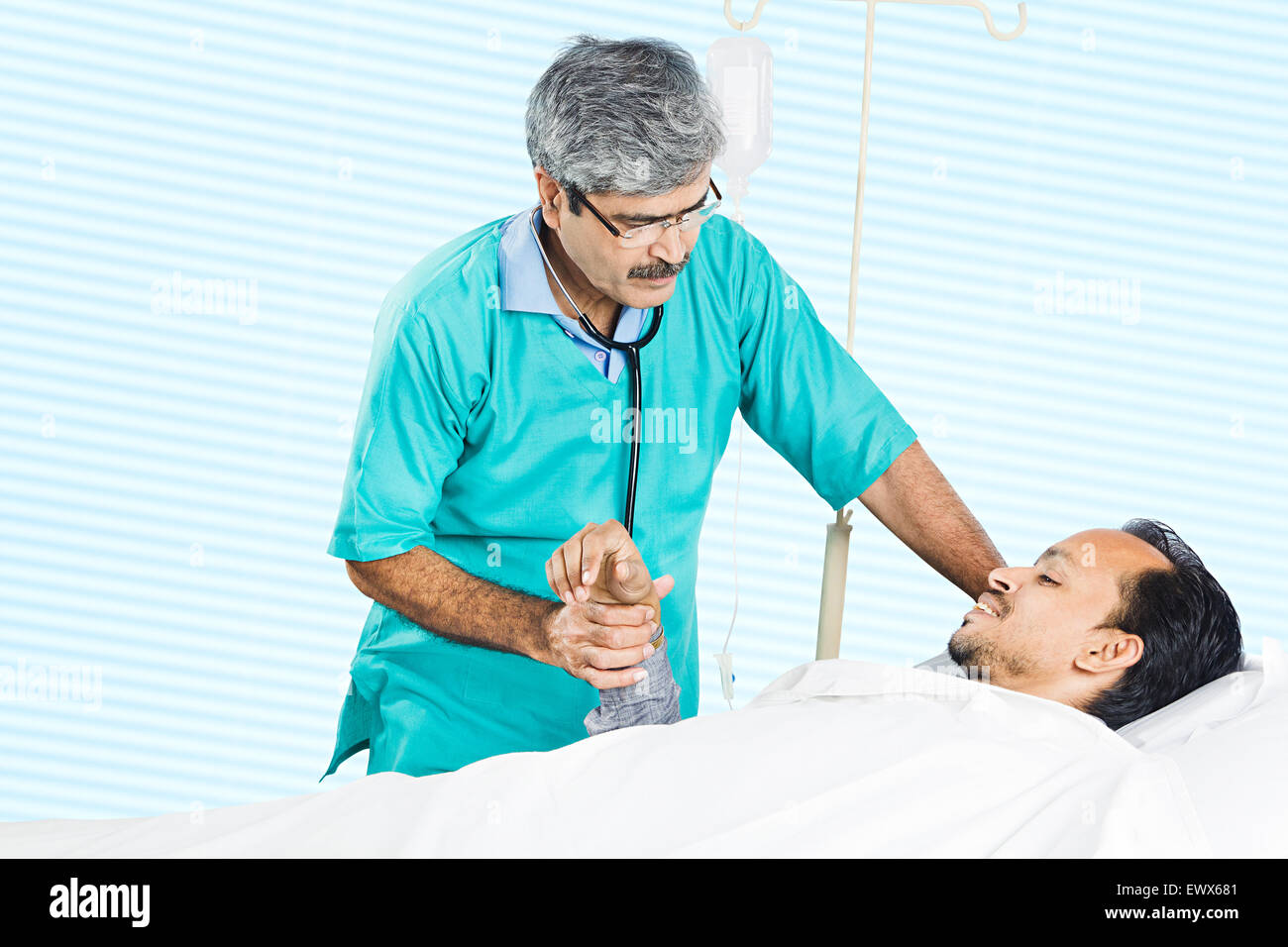 indian Doctor Patient Checking Stock Photo - Alamy