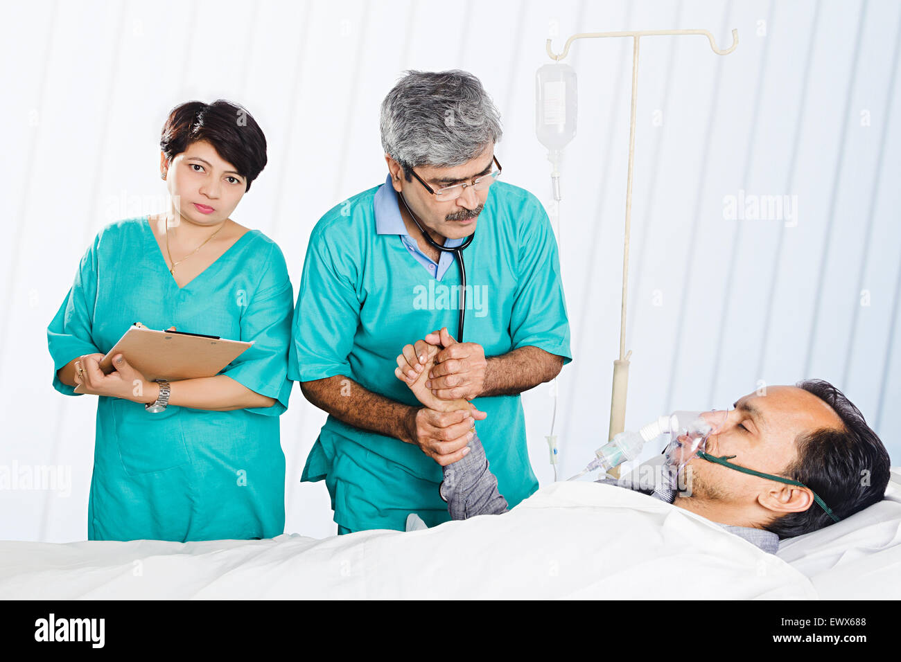 indian Doctor Patient Checking Stock Photo - Alamy