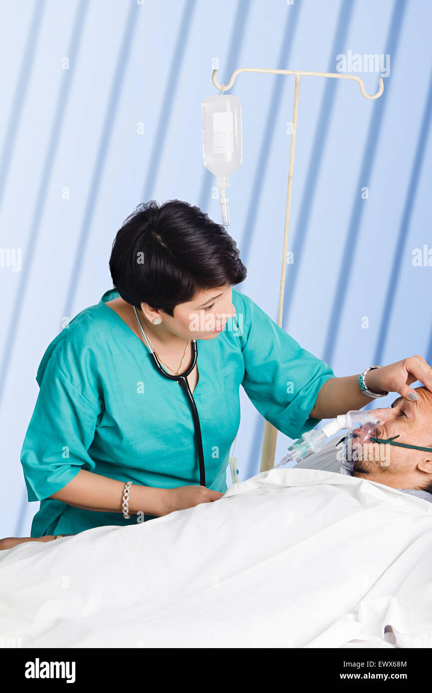 indian Doctor Patient Checking Stock Photo - Alamy