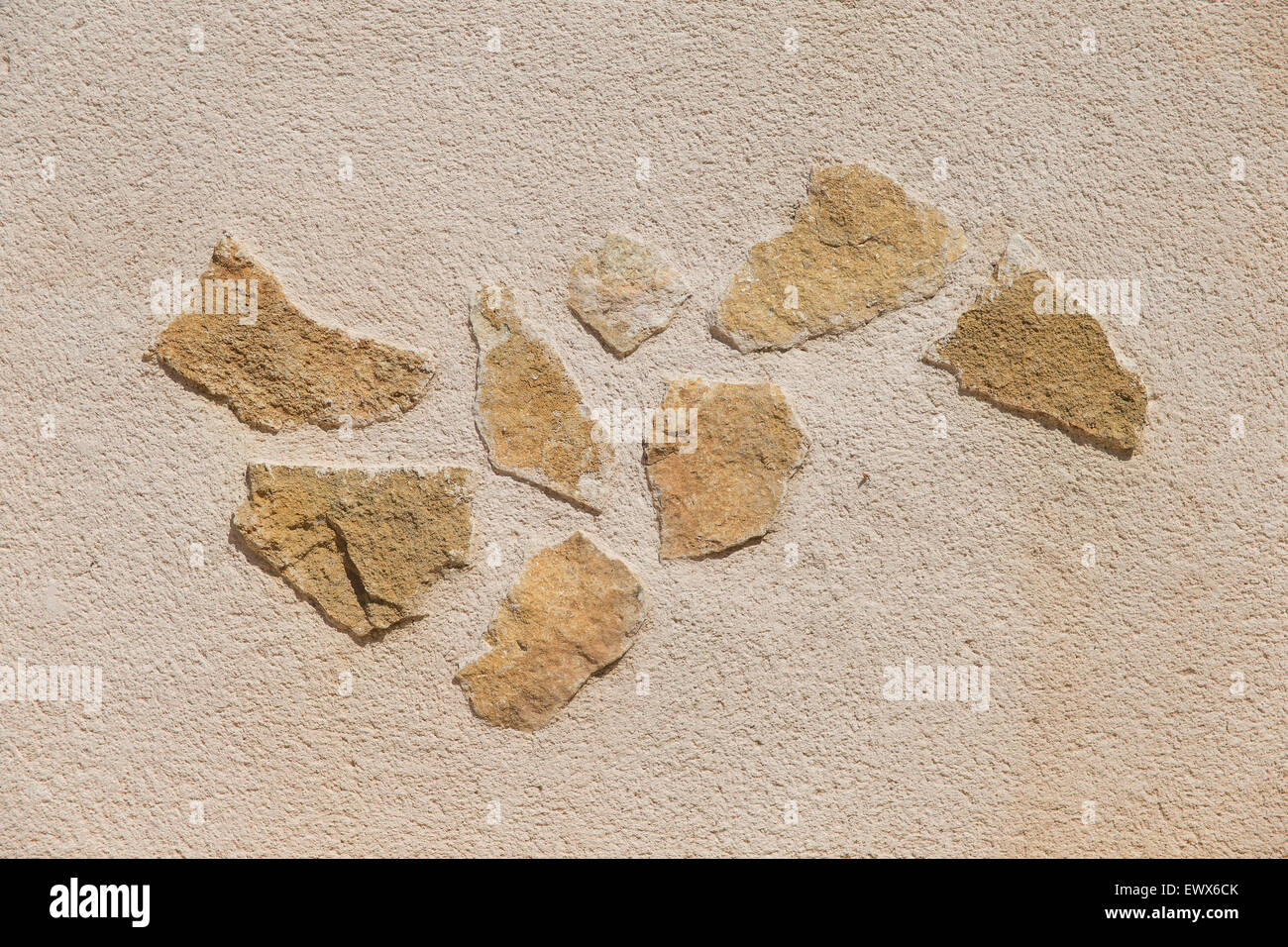 decorative stones embedded in wall Stock Photo - Alamy