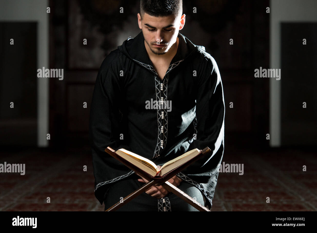 Arabic Muslim Man Reading Holy Islamic Book Koran Stock Photo - Alamy