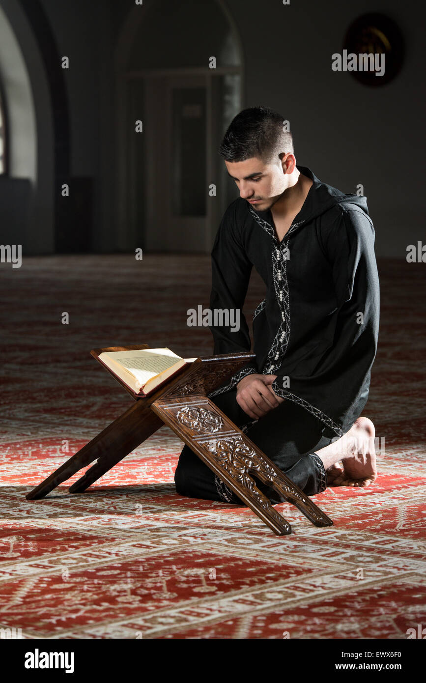 Arabic Muslim Man Reading Holy Islamic Book Koran Stock Photo - Alamy