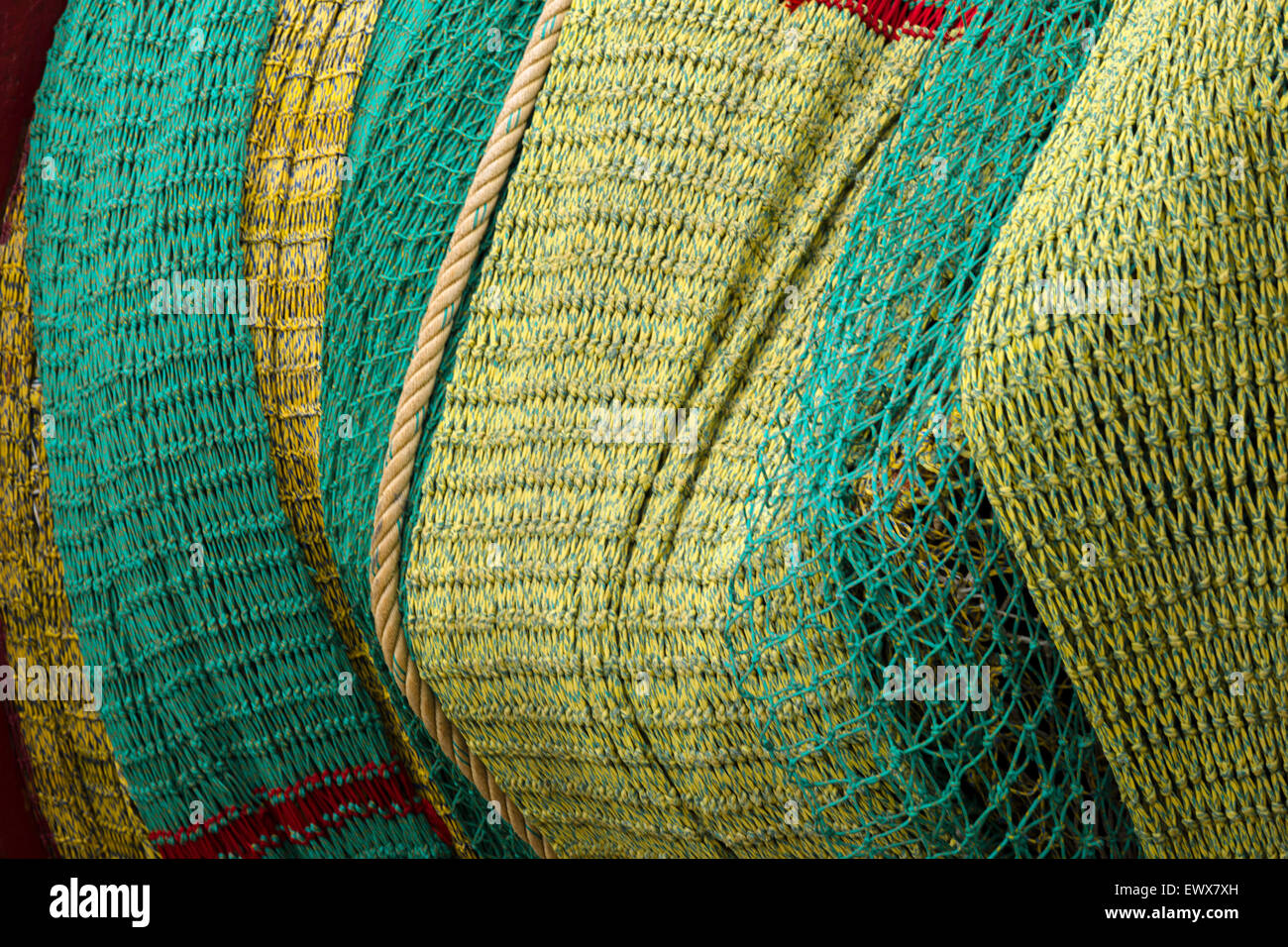 Still life of fishing gear, such as colorful nets, in shades of green ...