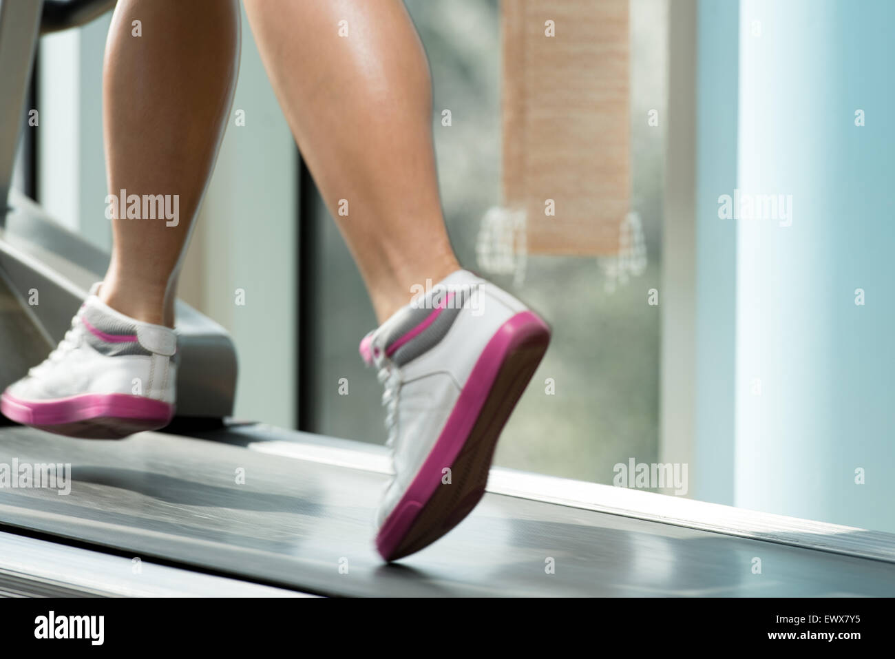 Close-Up Of Female Legs Running On Treadmill - Blurred Motion Stock ...