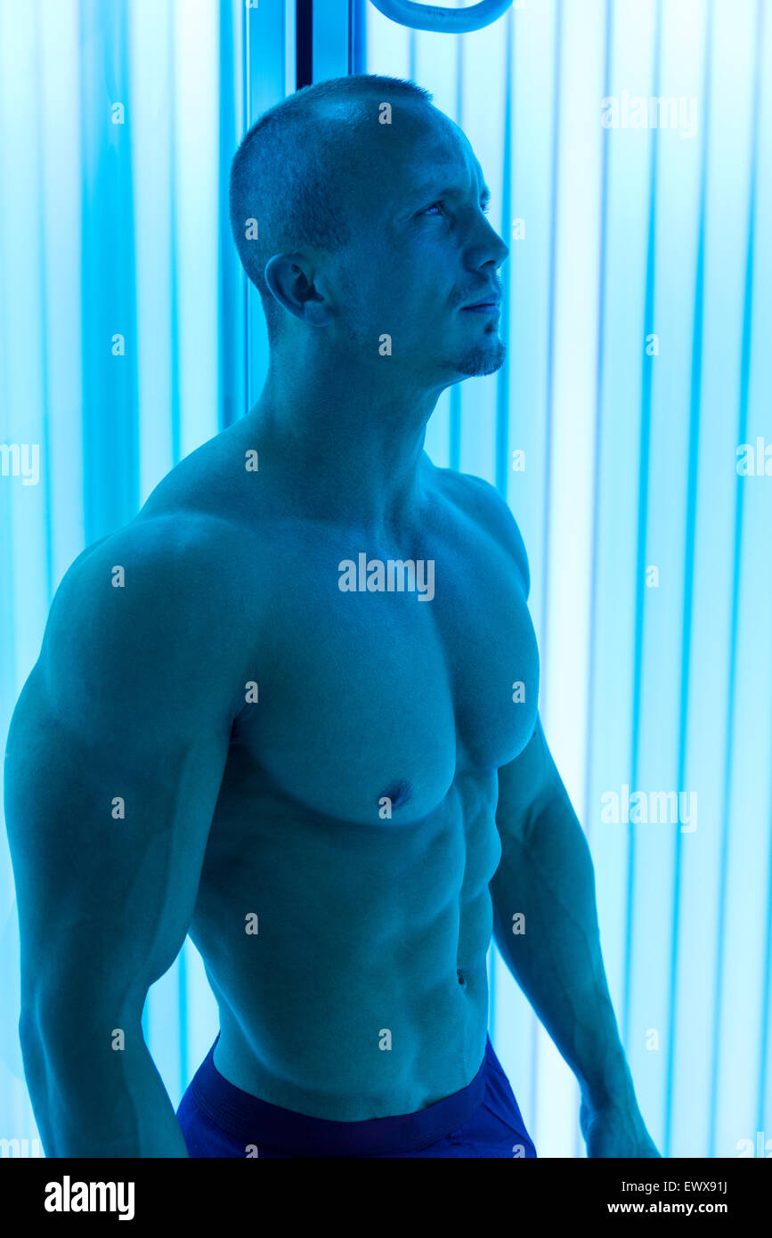 Young Muscular Man At Solarium In Beauty Salon Stock Photo - Alamy