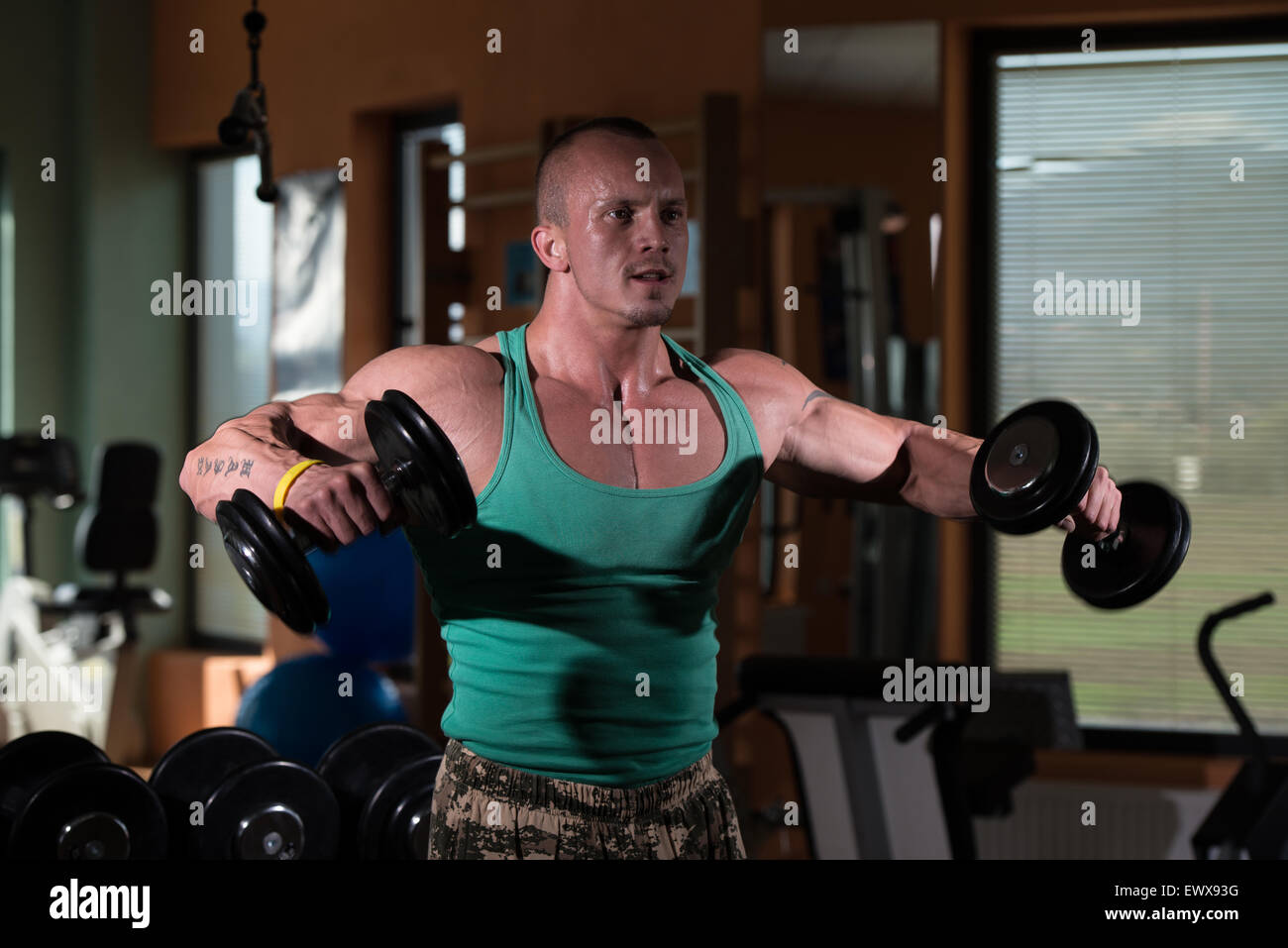 Young Man Preforming Dumbbell Lateral Raise - Exercise For Shoulders ...