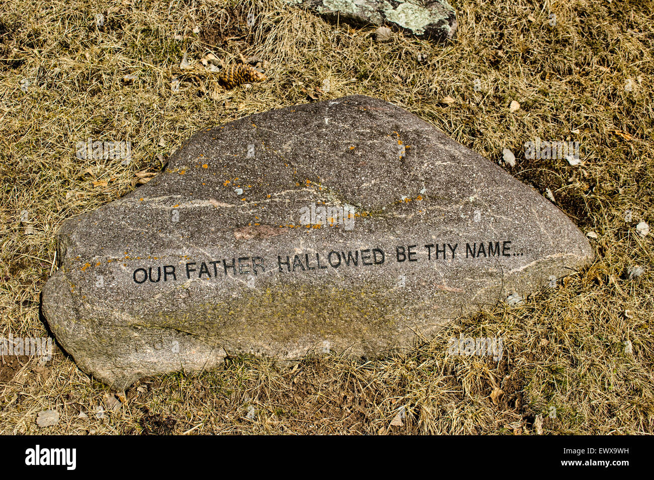 English sentence from The Lord’s Prayer printed in block letters on a ...