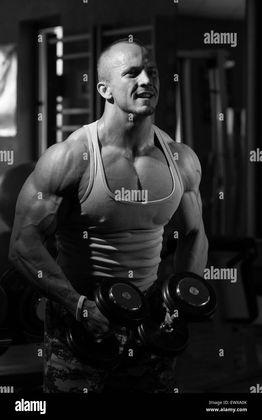 Young Man Preforming Dumbbell Lateral Raise - Exercise For Shoulders ...