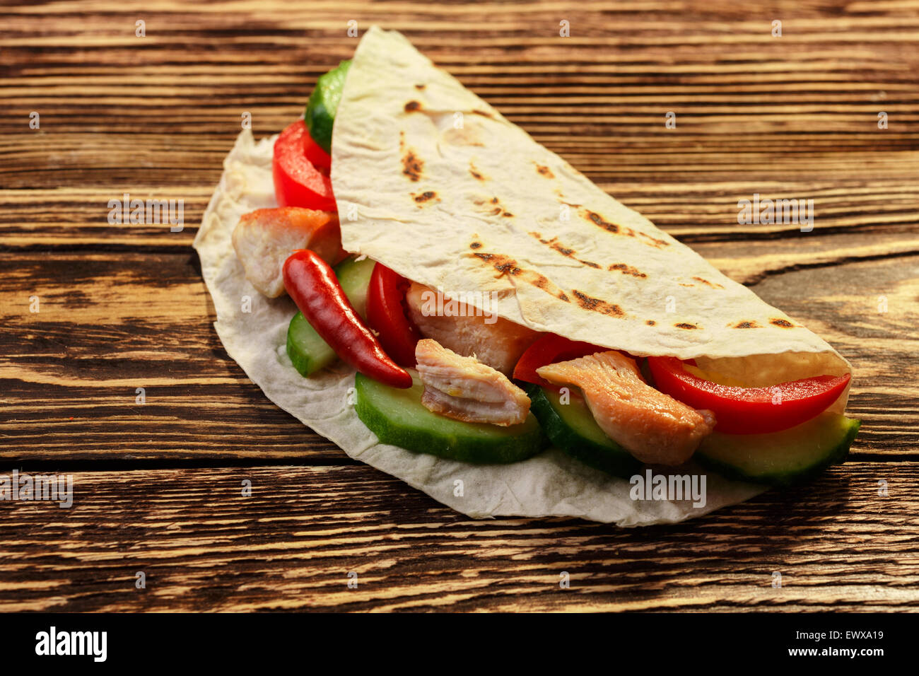 Traditional shawarma wrap with chicken and vegetables Stock Photo - Alamy