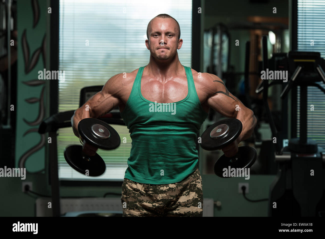 Young Man Preforming Dumbbell Lateral Raise - Exercise For Shoulders ...