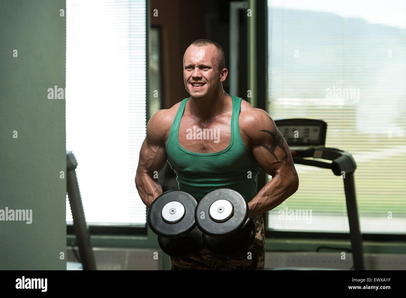Young Man Preforming Dumbbell Lateral Raise - Exercise For Shoulders ...