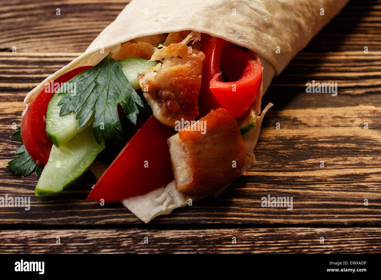 Traditional shawarma wrap with chicken and vegetables Stock Photo - Alamy