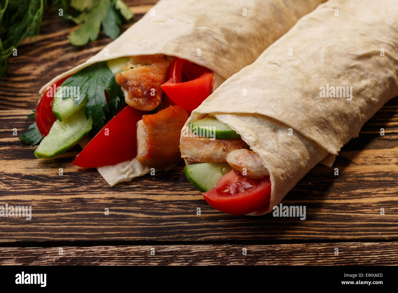 Traditional shawarma wrap with chicken and vegetables Stock Photo - Alamy