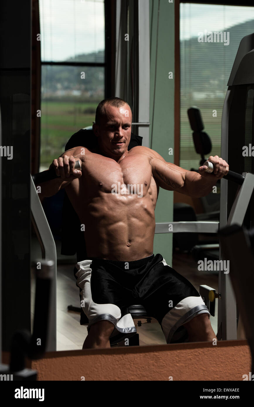 Young Man Doing Heavy Weight Exercise For Chest Stock Photo - Alamy